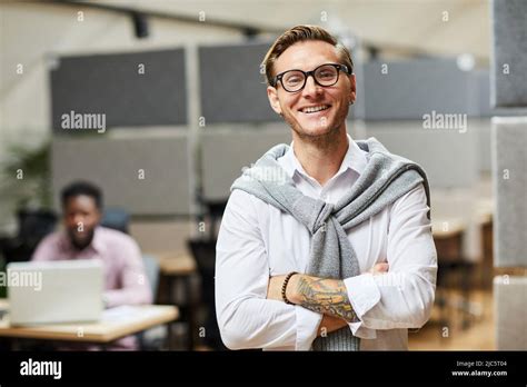Portrait Of Positive Excited Young App Developer With Sweater Wrapped