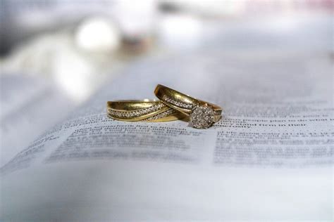 Gold Diamond Ring On White Printer Paper Photo Free Ring Image On Unsplash