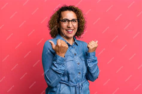Premium Photo Smiling Joyfully And Looking Happy Feeling Carefree And