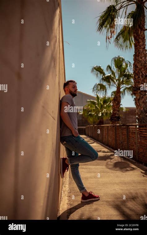 Man Portrait Leaning On A Wall Stock Photo Alamy