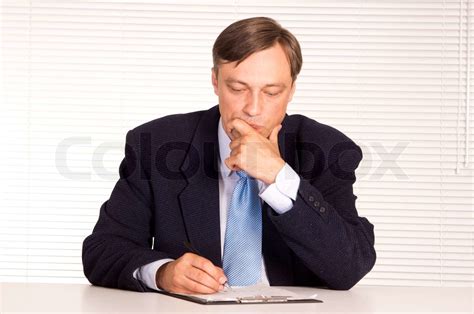 Man At Table Stock Image Colourbox