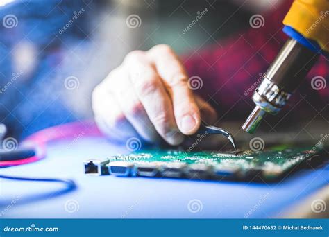 Worker Fixing CPU Board Of A Computer Stock Photo Image Of Hardware Installing