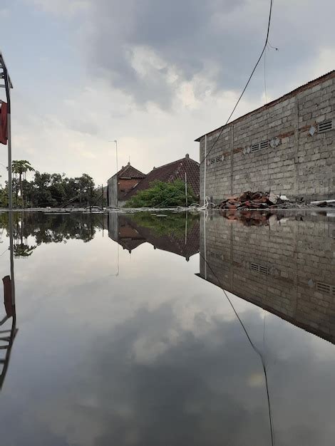 Premium Photo Reflection Of Rainwater Puddles