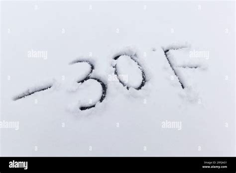 Drawn On The Snow Temperature Symbols Denoting Negative Very Cold Weather Which Is Marked In