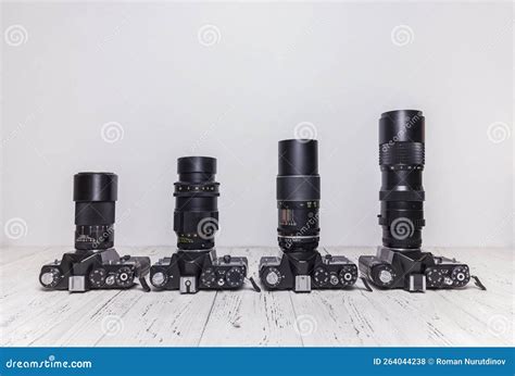 Old Retro Cameras With Different Focal Lengths Of The Lens Stock Photo