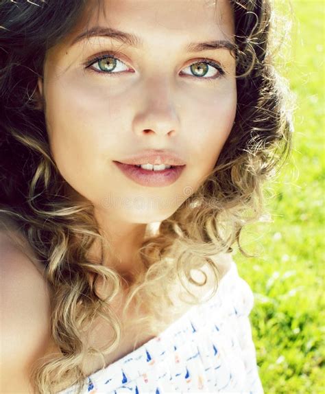 Young Cute Adorable Real Summer Girl On Green Grass Outside Relaxing