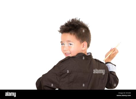 Little Boy Backwards Looking To Camera Drawing In The Air Isolated