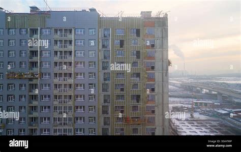 Residential Building Exterior Under Construction Workers Installing