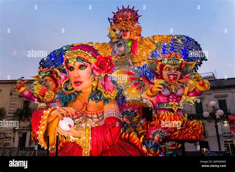 Huge Floats With Colourful Moving Figures Are Pulled Through The