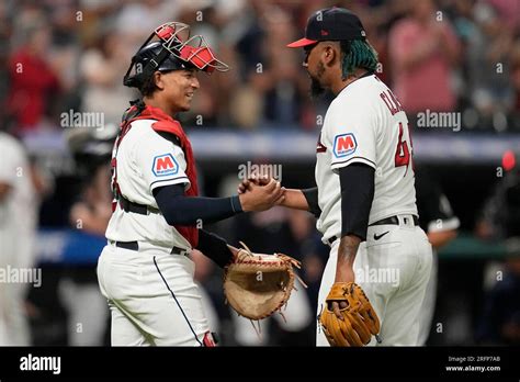 Cleveland Guardians Catcher Bo Naylor Left And Relief Pitcher
