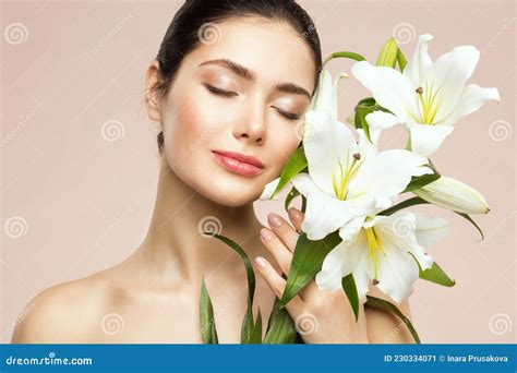 Woman Beauty Face Portrait With Lily Flower Model Girl With Smooth