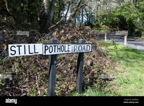 Road Sign With Actual Street Name Replaced By The Words Still Pothole
