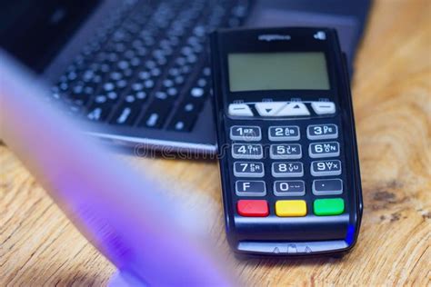 GPRS Payment POS Terminal On A Table With A Laptop Equipment For Payment By Bank Cards Stock