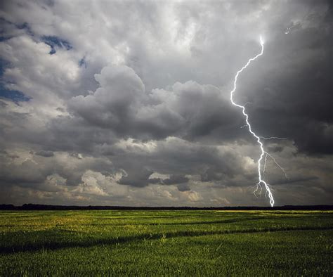 Royalty Free Photo Lightning On Green Field Under Cloudy Sky During