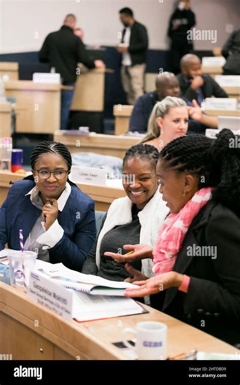 Spontaneous Picture Of Three African Woman Discussing And Smiling