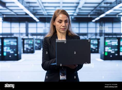 Technician In Data Center Implementing Backup Solutions To Protect Against Data Loss Using