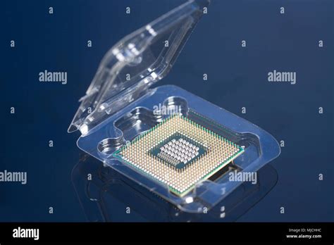 Central Processing Unit CPU Processor Microchip In The Packaging Box On Black Background Stock