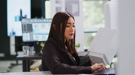 Developer Analyzing 3d Building Model At Realty Office Examining