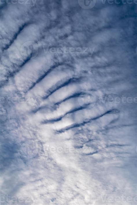 Beautiful Striated Cloud Formation In Sky Looking Like Fluffy Waves