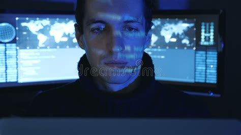 Close Up Portrait Of A Man Professional It Programmer In A Data Center Filled With Monitor