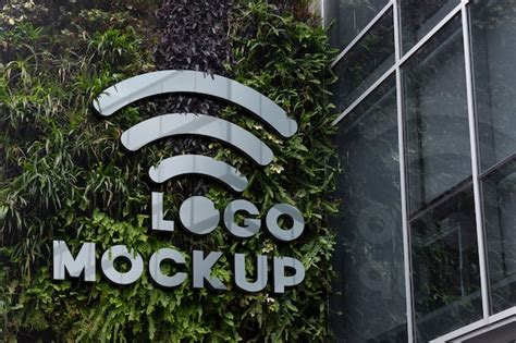 Premium Psd Wall Logo Mock Up Design With Vegetation Background