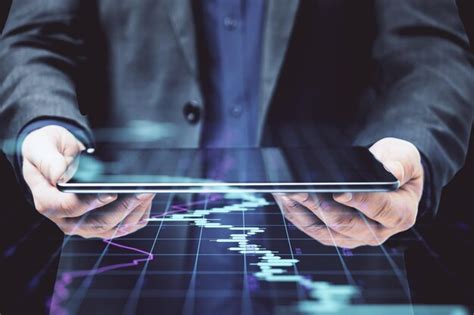Premium Photo Businessman Holding Tablet With Abstract Forex Chart