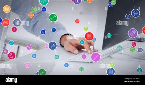 Composition Of Network Of Connections With Digital Icons Over Businessman Using Computer