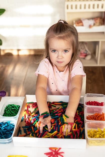 Premium Photo Portrait Of Cute Girl Sitting On Table