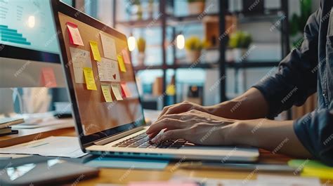 Business Developer Using Kanban Board Framework On Laptop Screen