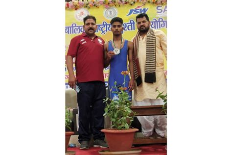 Wrestler Surya Udhay Partap Singh Showing Silver Medal While Posing