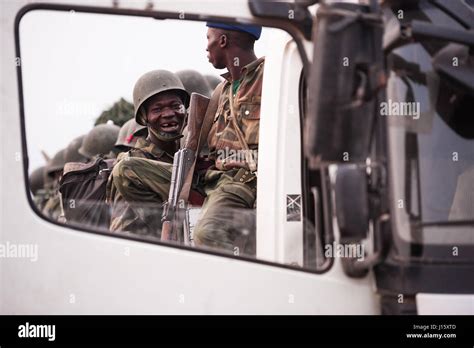 A Drc National Army Fardc Soldier Reflected In The Mirror Of A Truck