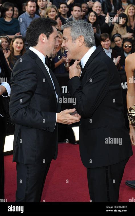 George Clooney Speaks With Demian Bichir As They Arrive For The 84th