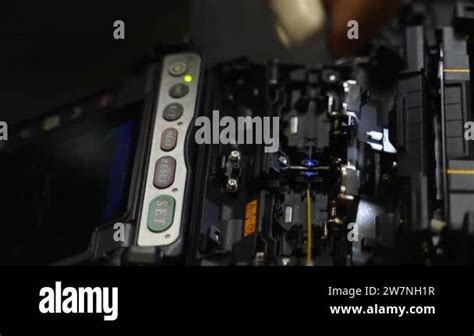 Worker Welds Optical Line Internet Wire With Welding Machine Service
