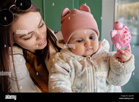 Mother Holding Baby Smiling To Camera Real Life Authentic Casual Mom Looking To Camera Holding