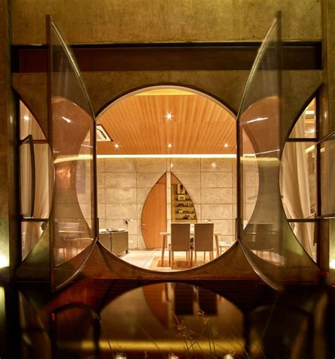 The Interior Of A Modern Home With Circular Glass Windows