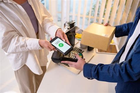 Premium Photo Woman Customer Using Qr Code Payment Via Smartphone For