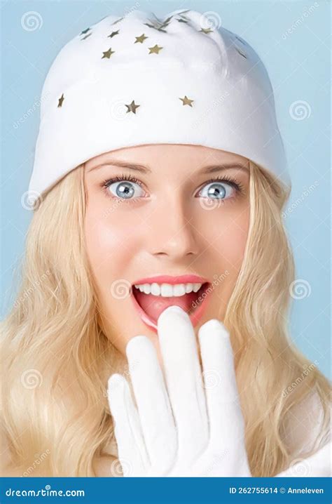 Girl With Blond Hair And Blue Eyes Seems Surprised And Amused While