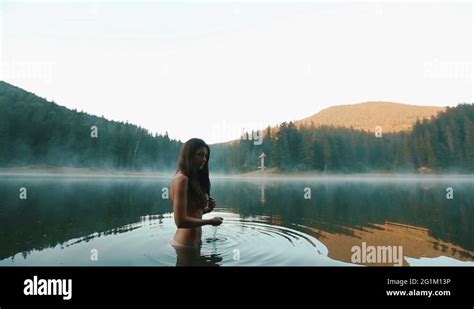 Beautiful Naked Fairy Or Mermaid Combing Her Long Dark Hair In The Mystical Stock Video Footage