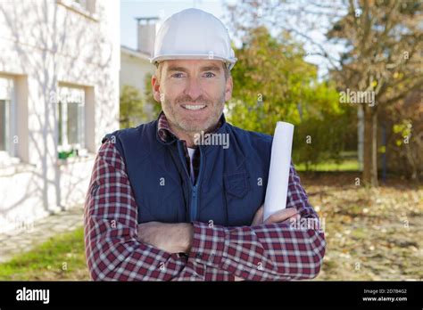 Building Inspector Posing Arms Crossed At Construction Site Stock Photo Alamy