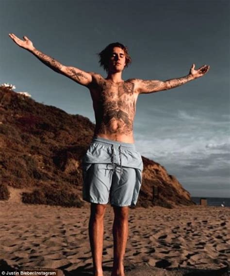 Justin Bieber Flaunts Heavily Tattooed Chest As He Reveals He S Spent Over Hours Getting