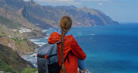 North Of Tenerife Rear View Of Unrecognizable Redhead Woman Sits On