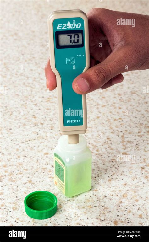 calibrating a ph meter buffer solution green being used to calibrate