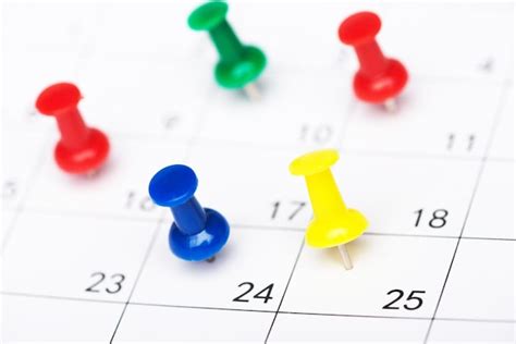 Premium Photo Setting An Important Date On A Calendar