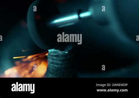 Metal Bolt Of Car Engine Is Grinded With Hand Held Power Tool Close Up Concept Of Auto Repair