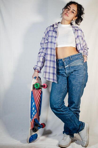 Premium Photo Young Woman Standing Against Wall