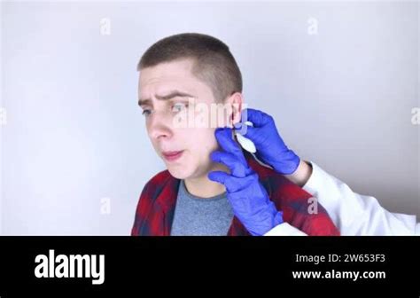 A Man Whose Ear Is Bleeding Vascular Rupture Damage To The Tympanic