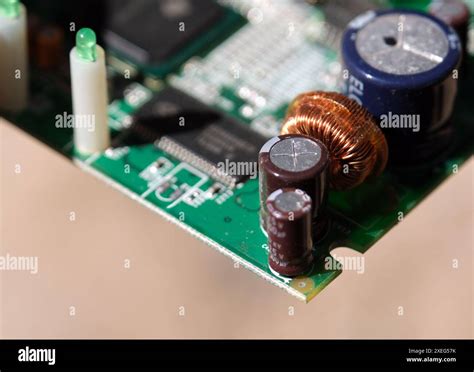An Electronic Circuit Board With Coils And Capacitors At The Focal