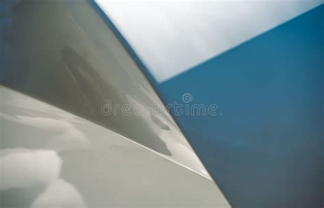Blue And Gray Abstract Background From Curved Lines Of Geometric Shapes