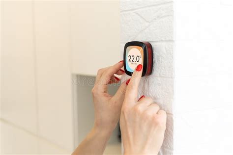 Smart Home Digital Thermostat Touch Screen Woman Touching Touchscreen To Adjust Temperature Of