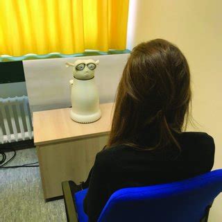 A Participant Listens To The Robotic Storyteller Download Scientific